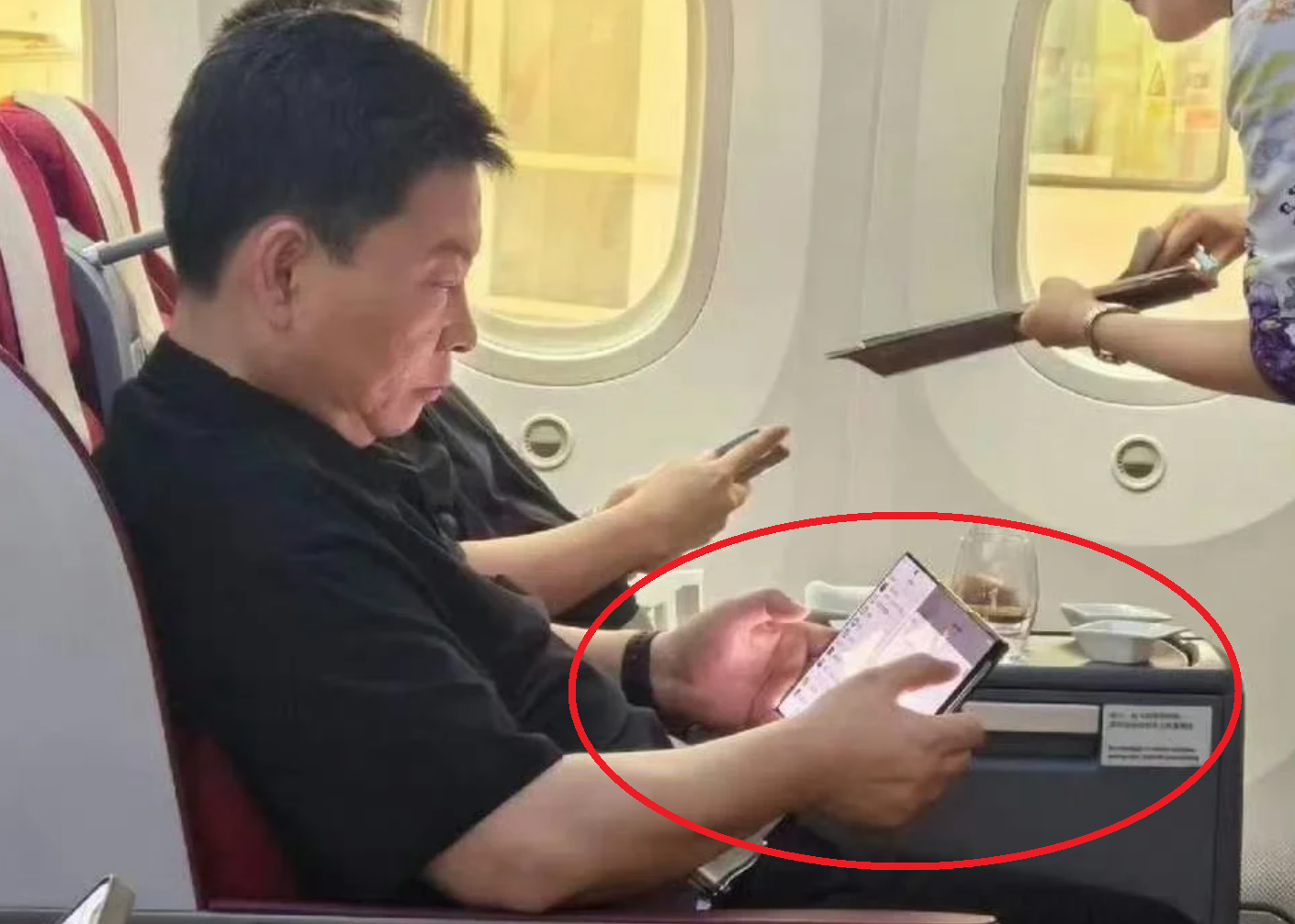 Huawei CEO photographed on plane with world's first tri-foldable smartphone